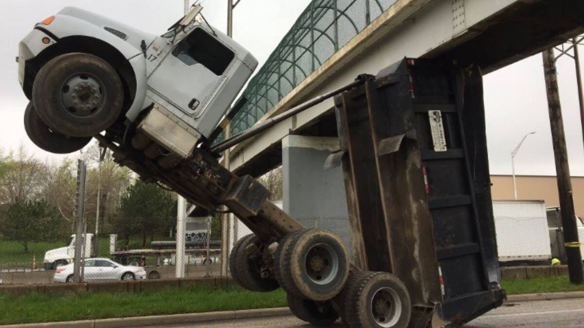 Garbage truck stuck against pedestrian bridge snarls Cleveland traffic